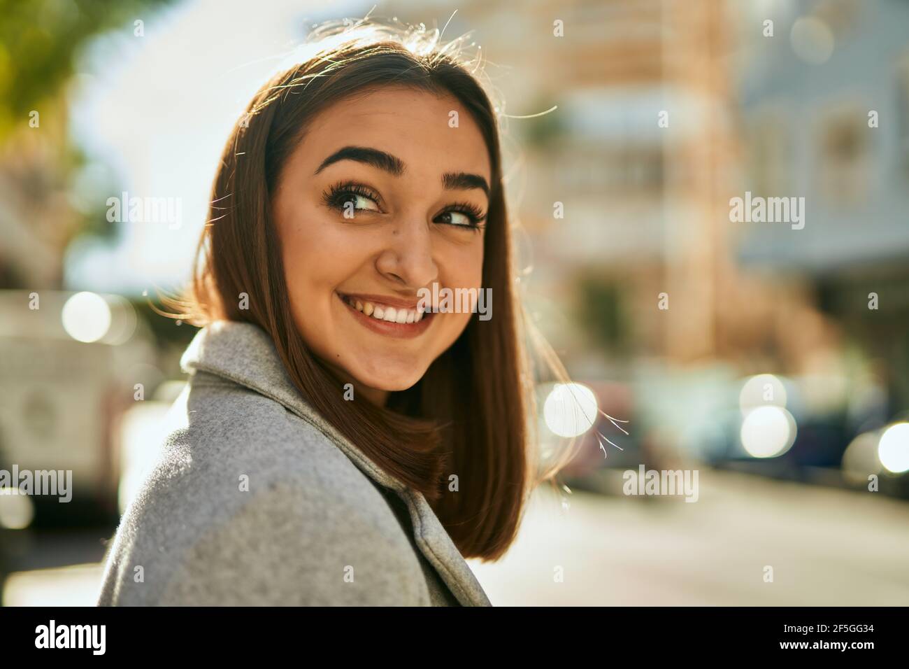 Young hispanic girl smiling happy standing at the city Stock Photo - Alamy