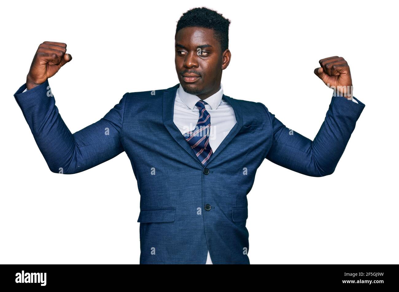 Handsome business black man wearing business suit and tie showing arms ...