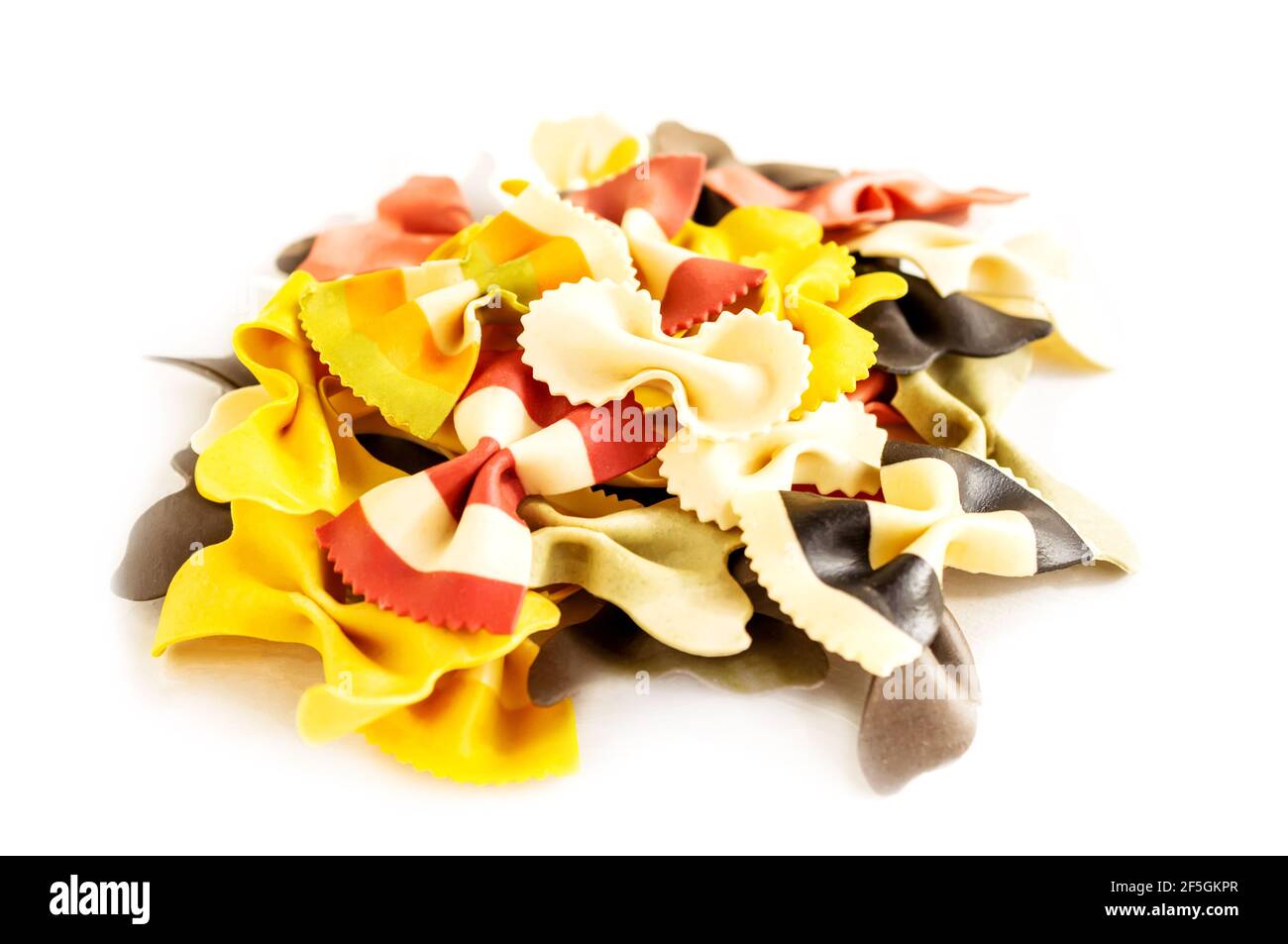 Assorted different colors of farfalle pasta. Multicolored farfalle ...