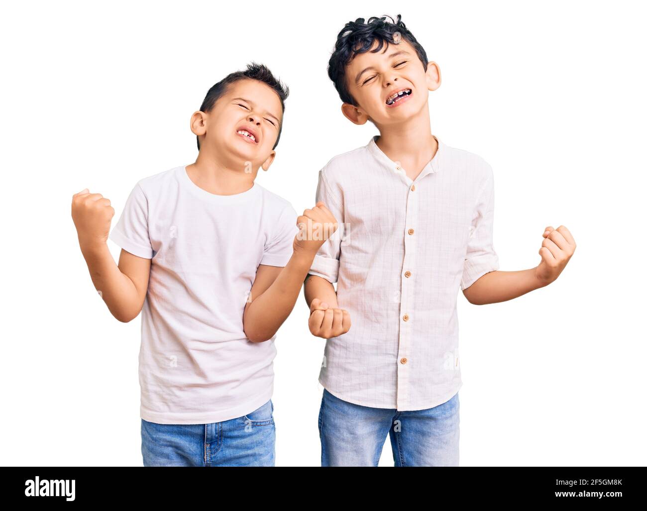 Couple of little brothers together wearing casual clothes very happy ...