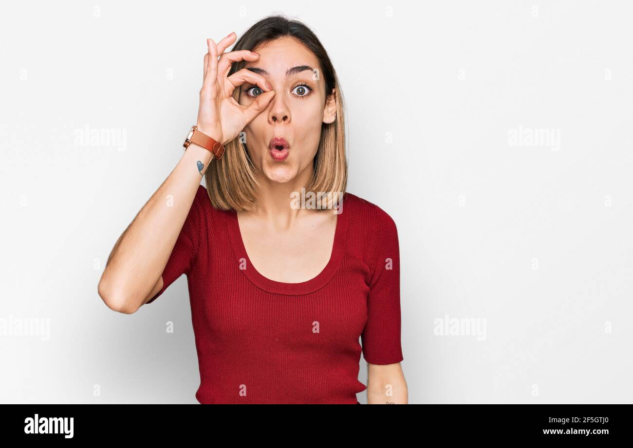 Young blonde girl wearing casual clothes doing ok gesture shocked with ...