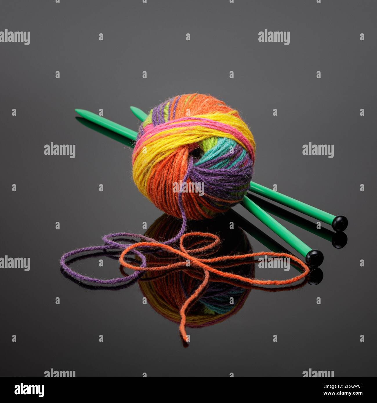 One ball of multi coloured knitting wool Stock Photo - Alamy