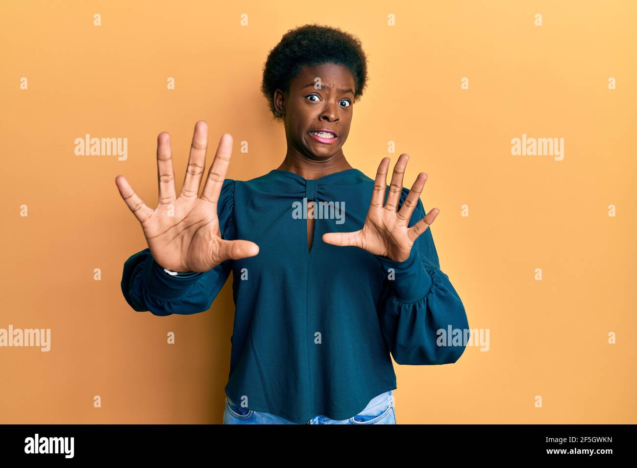 Young african american girl wearing casual clothes afraid and terrified ...