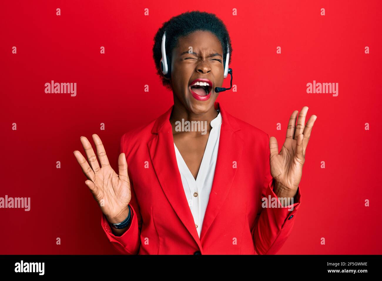 Young african american girl wearing call center agent headset ...