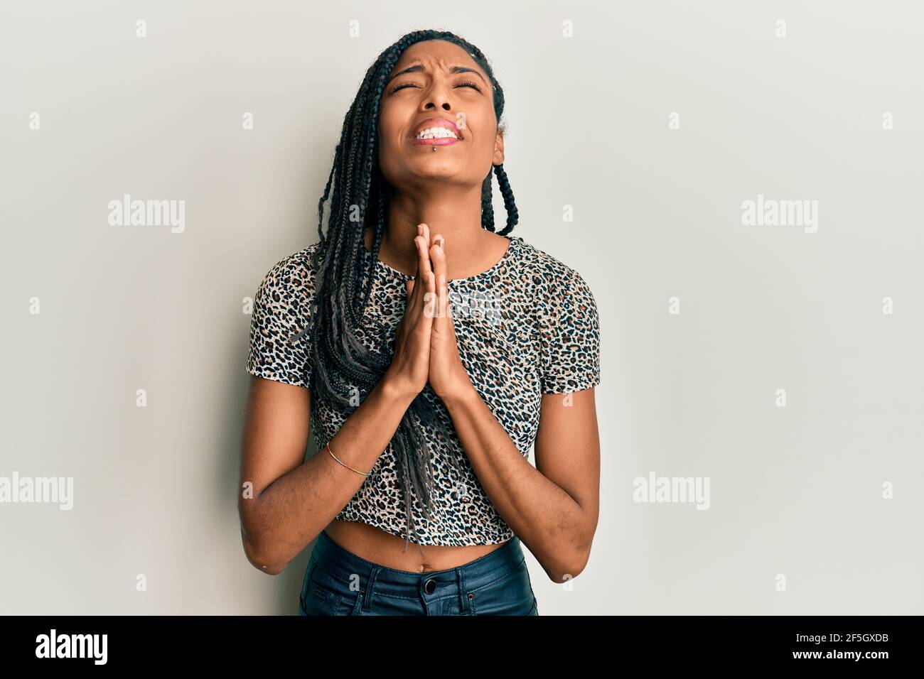 African american woman wearing casual clothes begging and praying with ...