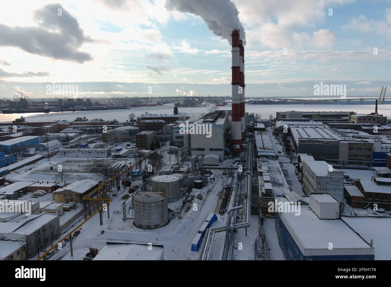 Steam from pipes of a thermal power plant over winter the city Stock ...