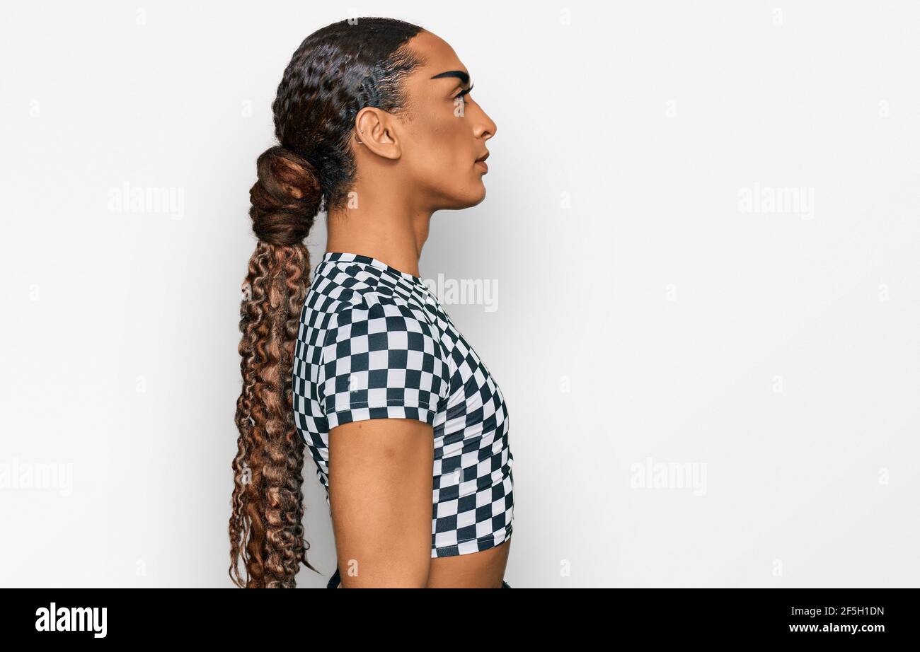 Hispanic transgender man wearing make up and long hair wearing modern ...