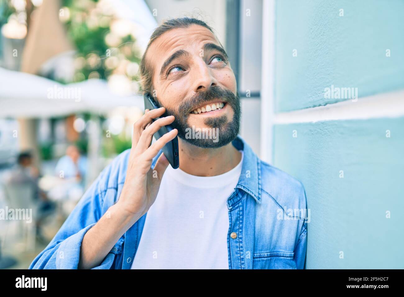 Young middle eastern man talking on the smartphone at the city Stock ...