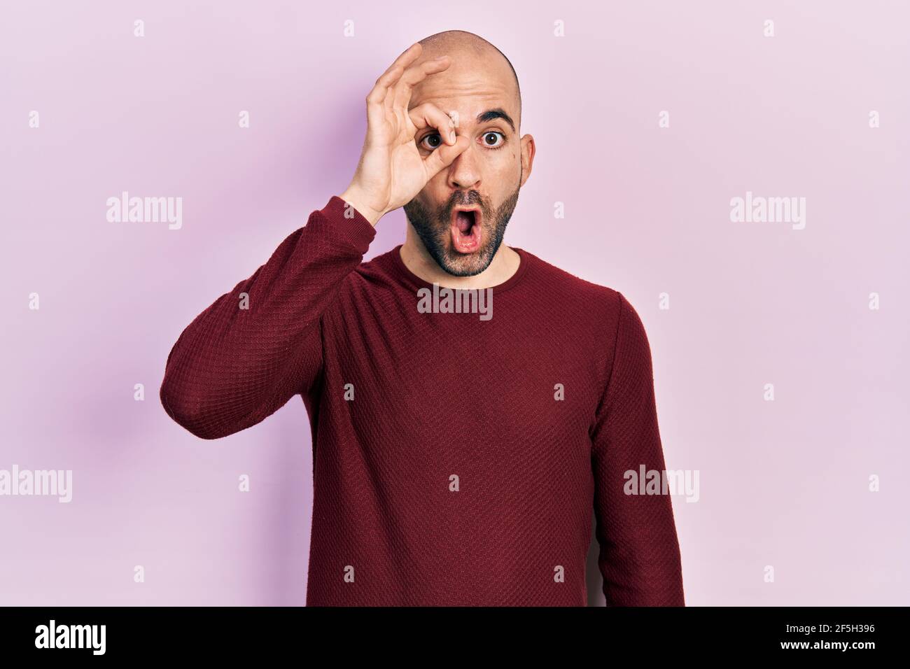 Young bald man wearing casual clothes doing ok gesture shocked with ...