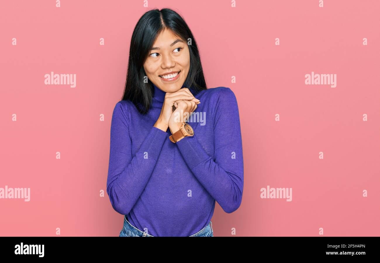 Happy young asian woman giggling hi-res stock photography and images ...