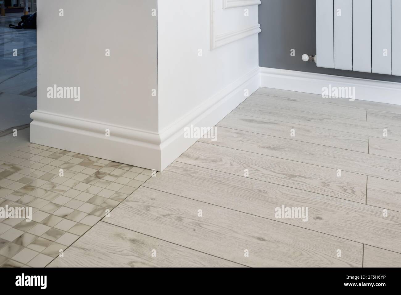 Detail of corner flooring with intricate crown molding and plinth Stock ...