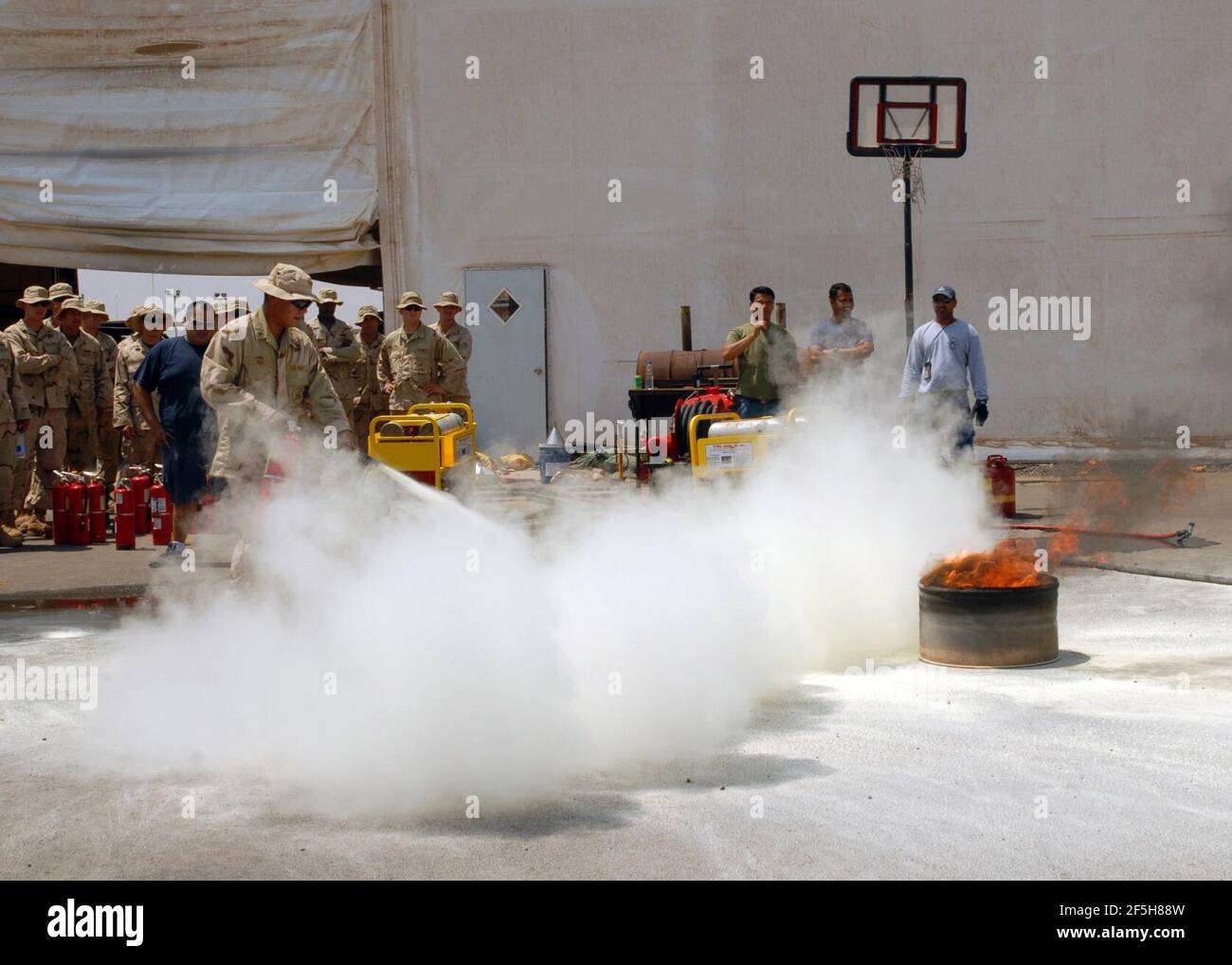 Putting out the fire Stock Photo - Alamy