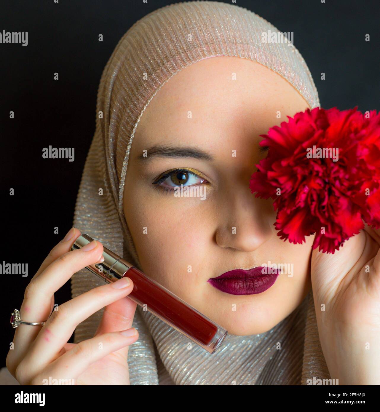 Woman with hijab, professional make-up, showing makeup items, black ...
