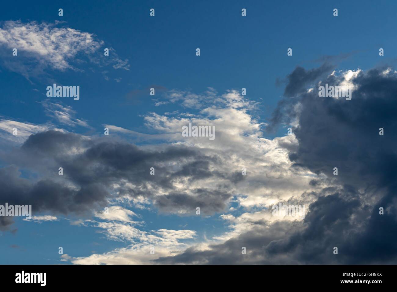Blue sky with thunderstorms clouds on sunset Stock Photo - Alamy