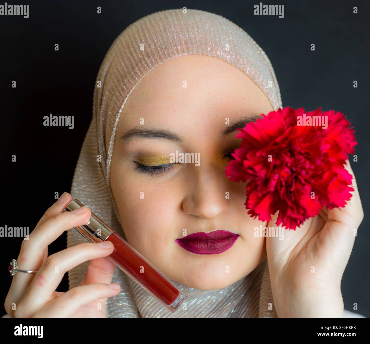 Woman with hijab, professional make-up, showing makeup items, black ...