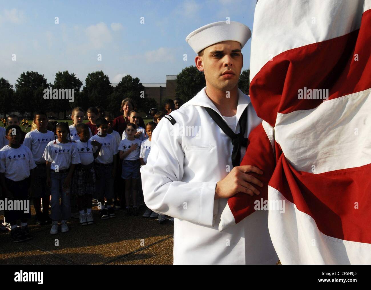 Raising the morning colors Stock Photo - Alamy