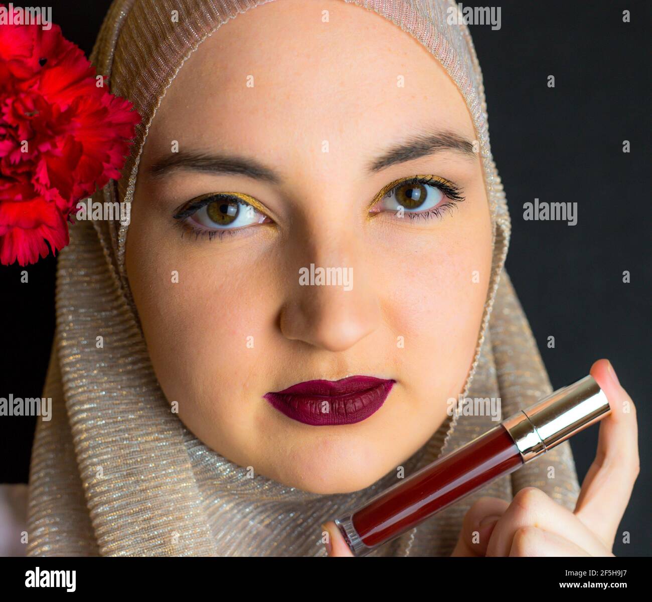 Woman with hijab, professional make-up, showing makeup items, black ...