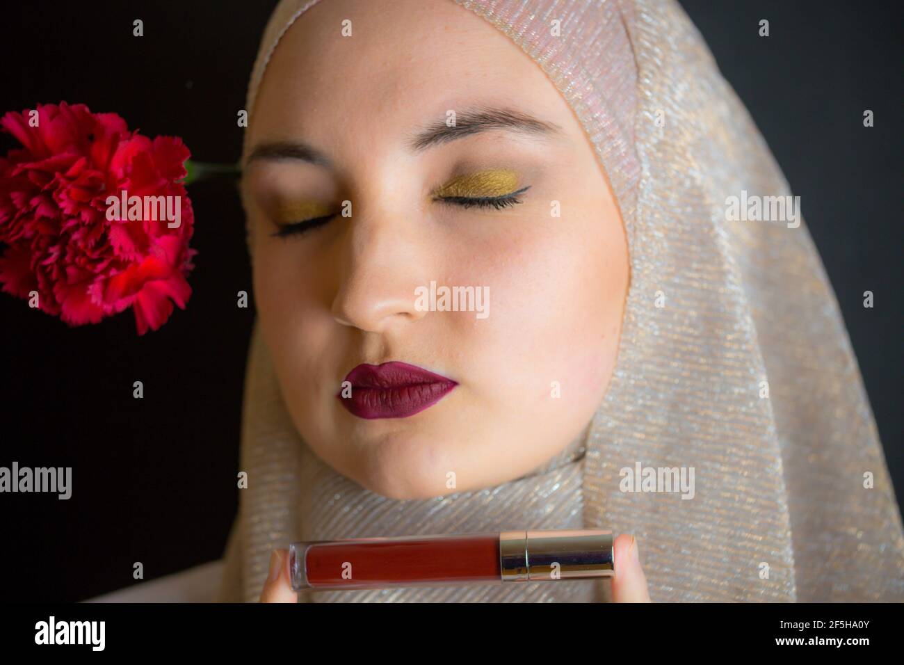Woman with hijab, professional make-up, showing makeup items, black ...