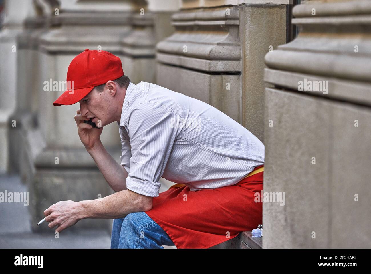 Street life of Vienna. Waiter's smoking break Stock Photo - Alamy