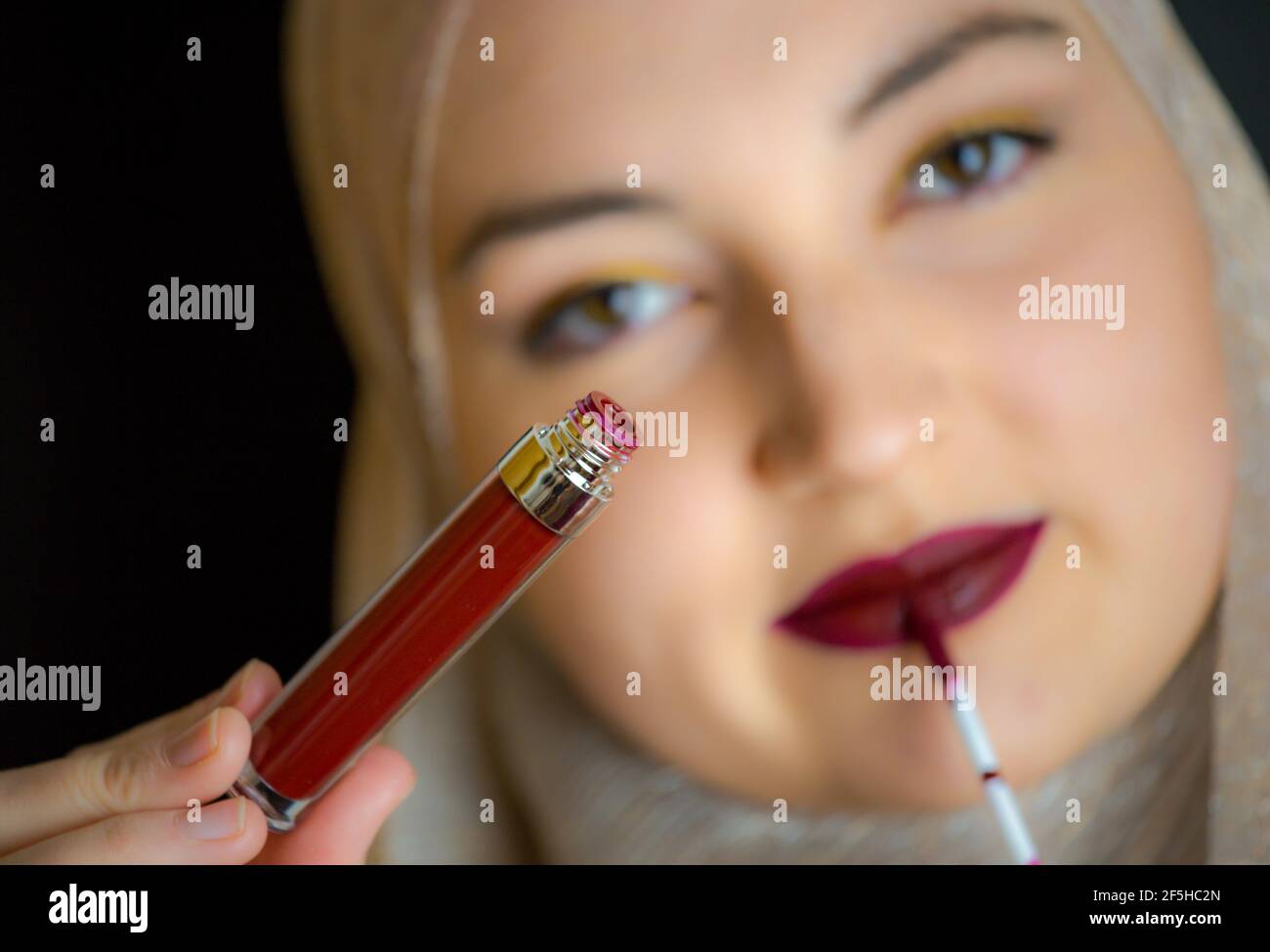 Woman with hijab, professional make-up, showing makeup items, black ...
