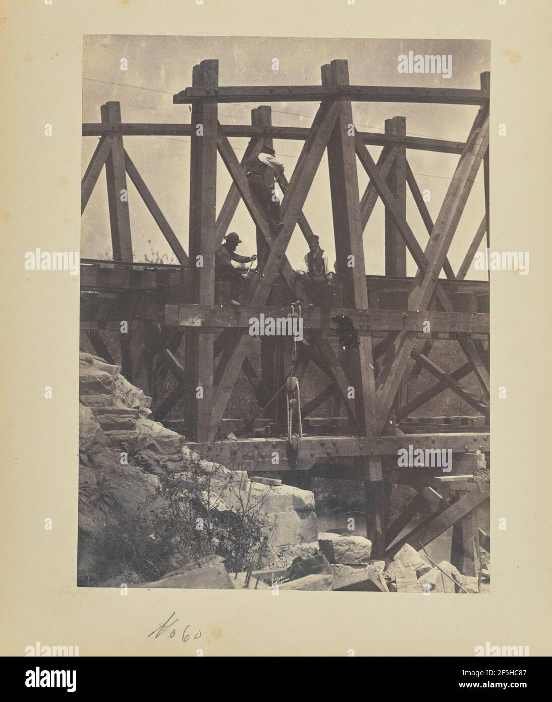 Boring holes in a bridge truss for explosives. A.J. Russell (American ...