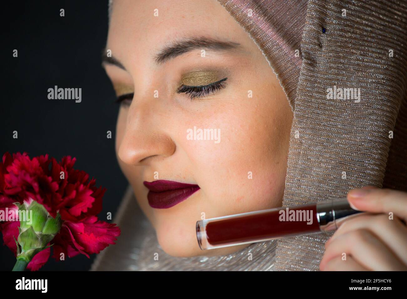 Woman with hijab, professional make-up, showing makeup items, black ...