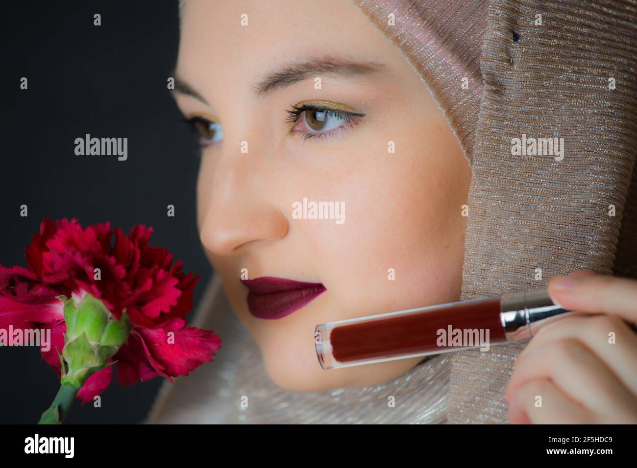 Woman with hijab, professional make-up, showing makeup items, black ...