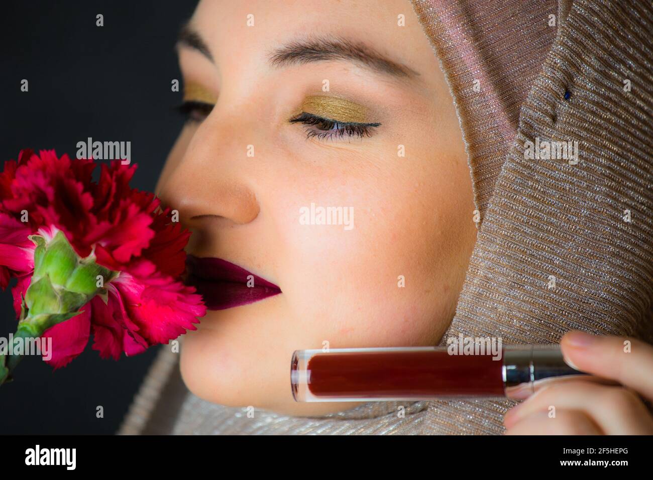 Woman with hijab, professional make-up, showing makeup items, black ...