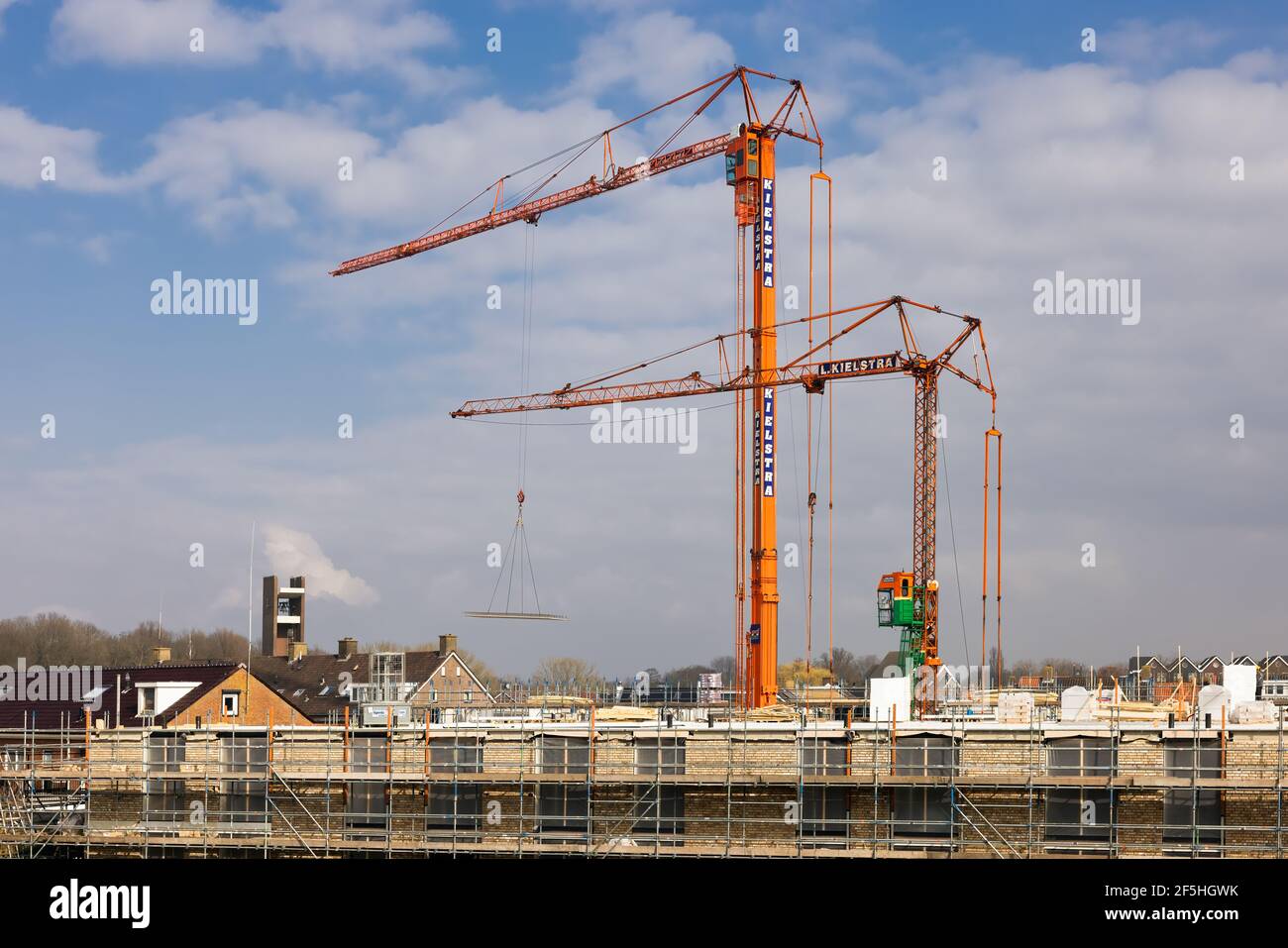Mobile tower cranes at construction site apartment building Dutch ...