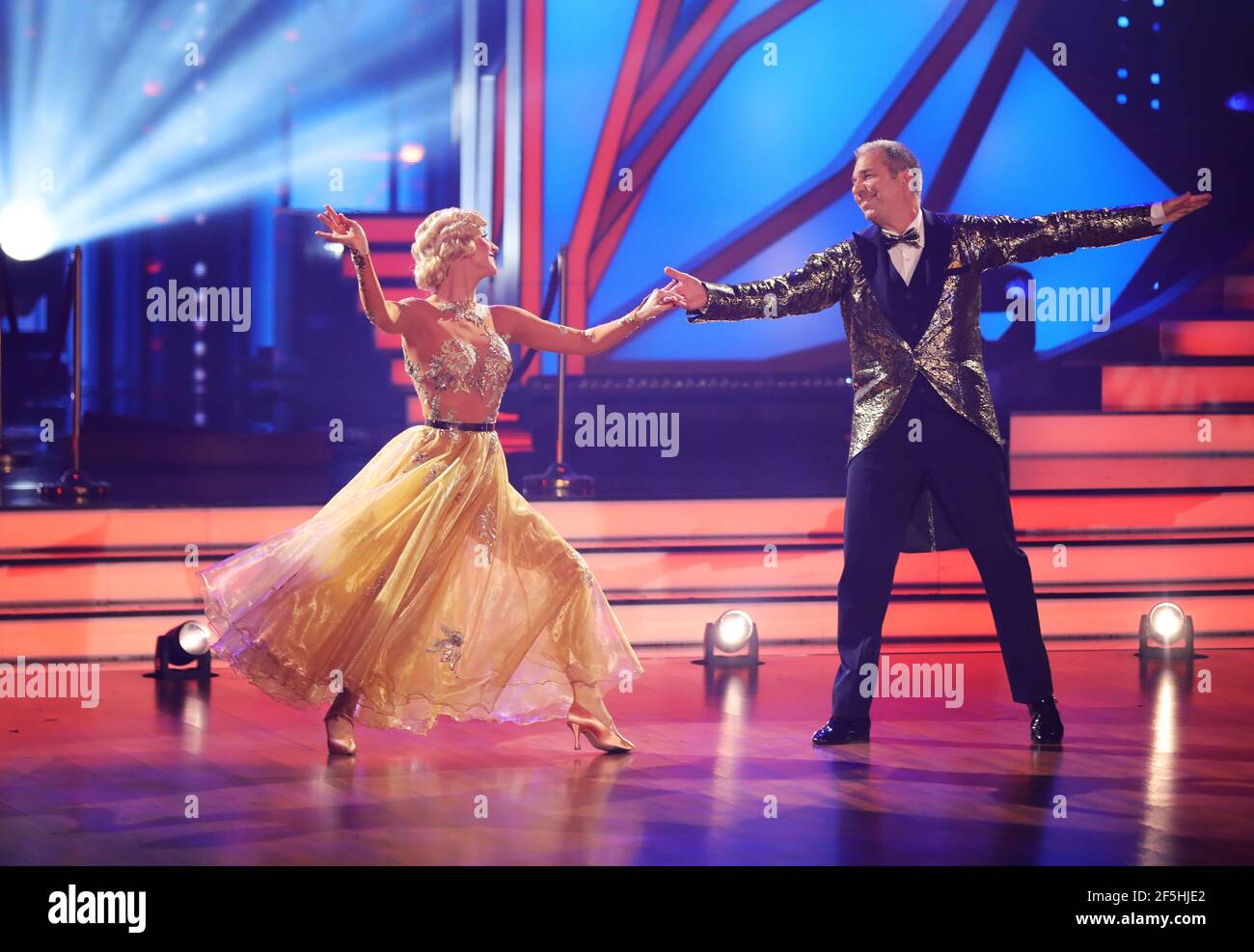 Cologne, Germany. 26th Mar, 2021. Sports reporter Kai Ebel and ...