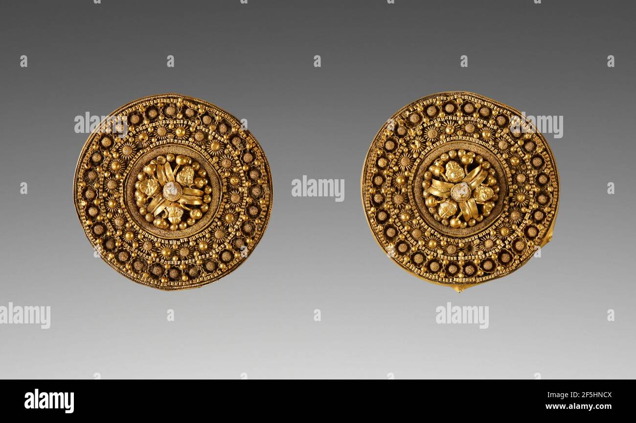 Disk Ear Stud. Unknown Stock Photo - Alamy