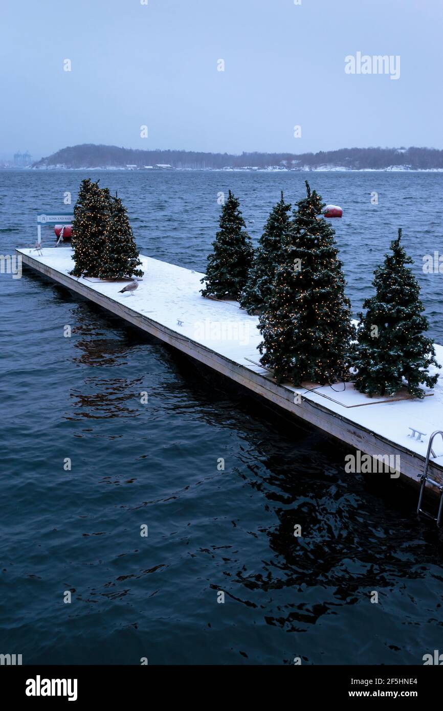 Christmas tree decorations stand on a jetty in Tjuvholmen, a ...