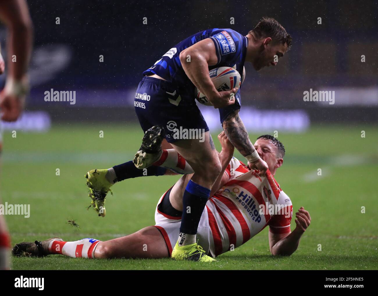 Wigan Warriors' Sam Powell and Leigh Centurions' Matty Gee during the ...