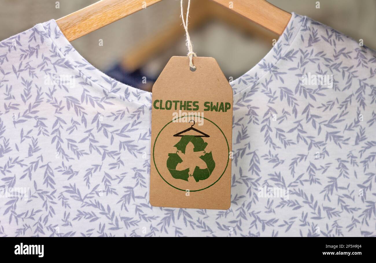 Clothes Swap and recycle clothes icon on label on t shirt, sustainable ...