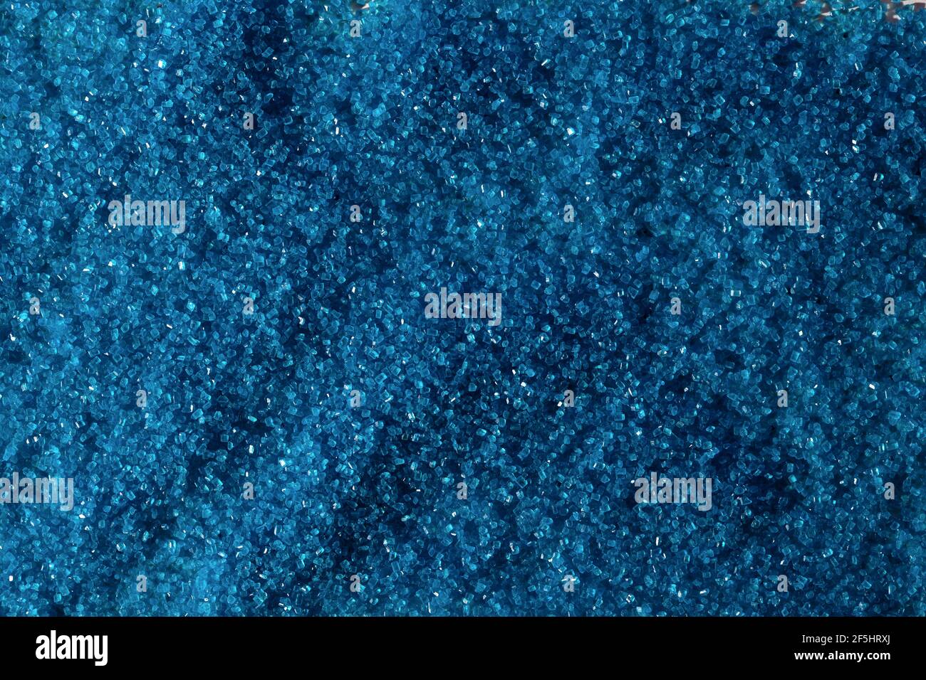 Blue colored edible sugar - sweet cake decoration on white background ...