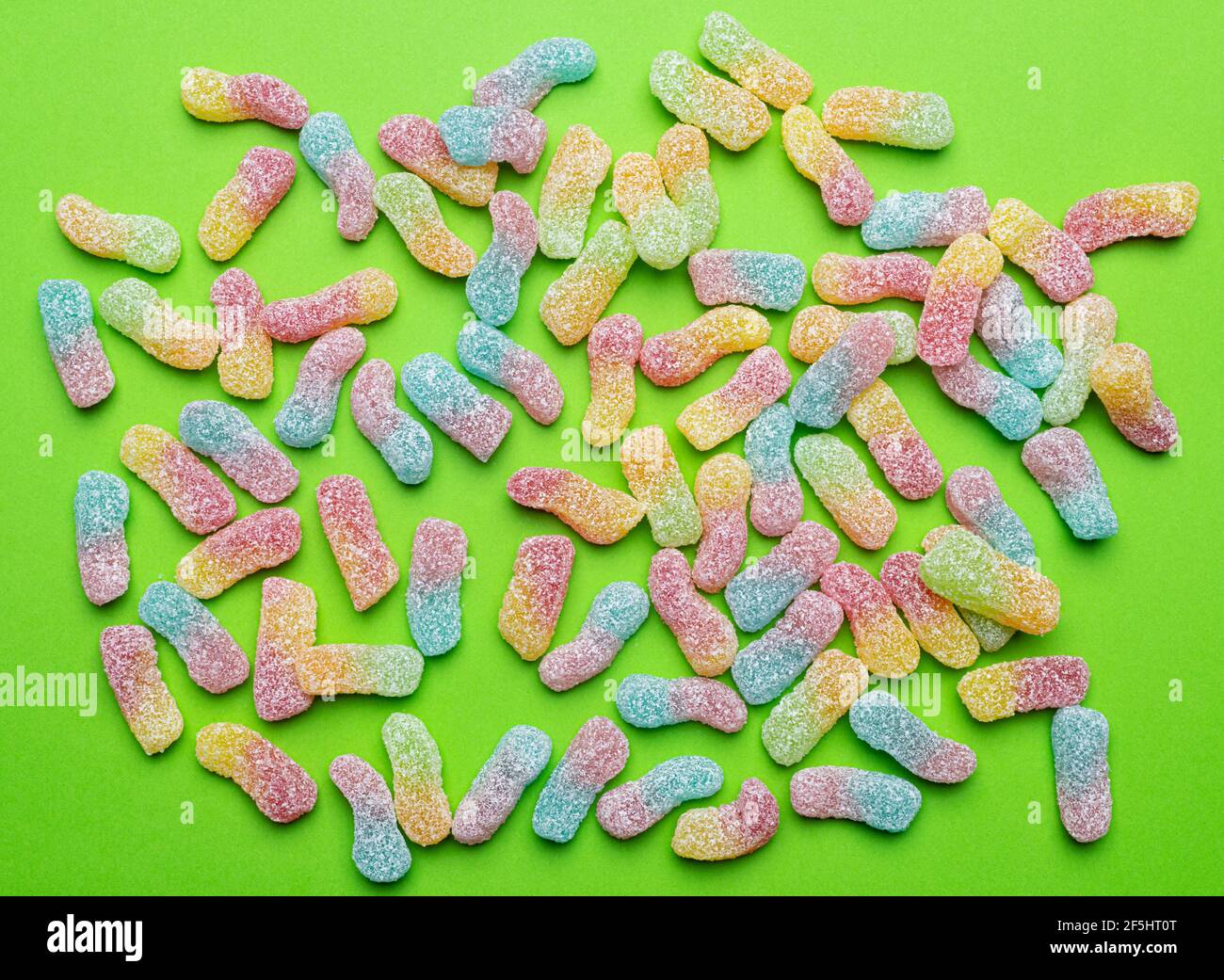 Sugar candies on a yellow surface Stock Photo - Alamy
