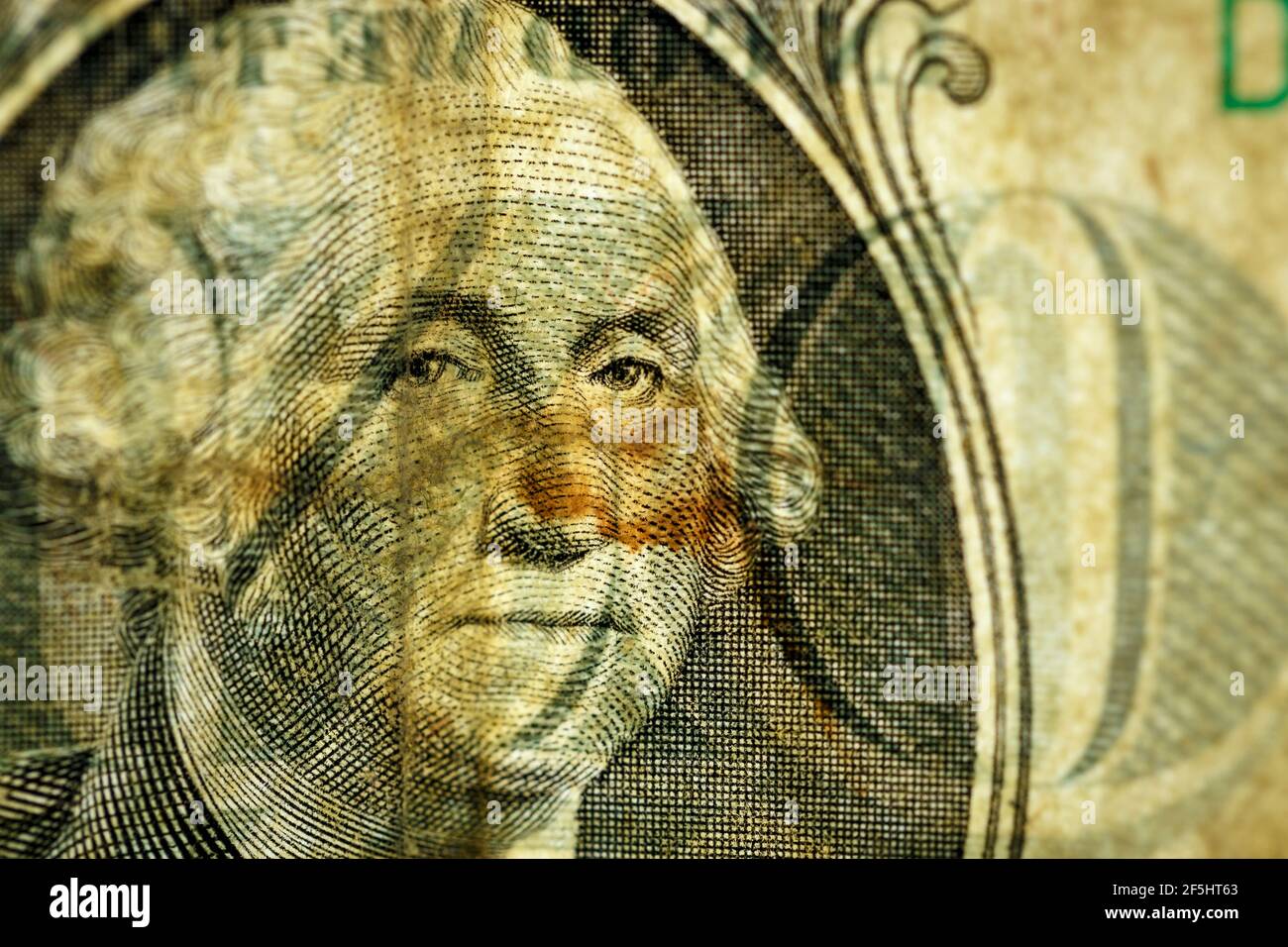 Horizontal macro of the front side of an old worn one-dollar bill with ...