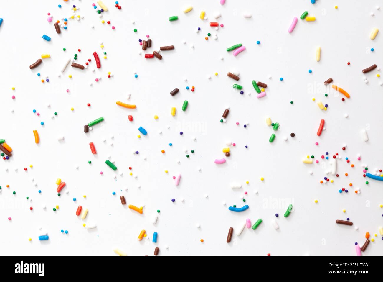 Colorful edible sugar sprinkles background - seamless pattern on white ...