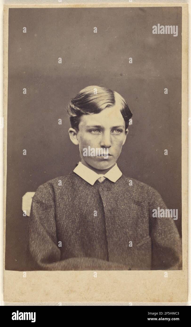 Unidentified boy, seated. Unknown Stock Photo - Alamy