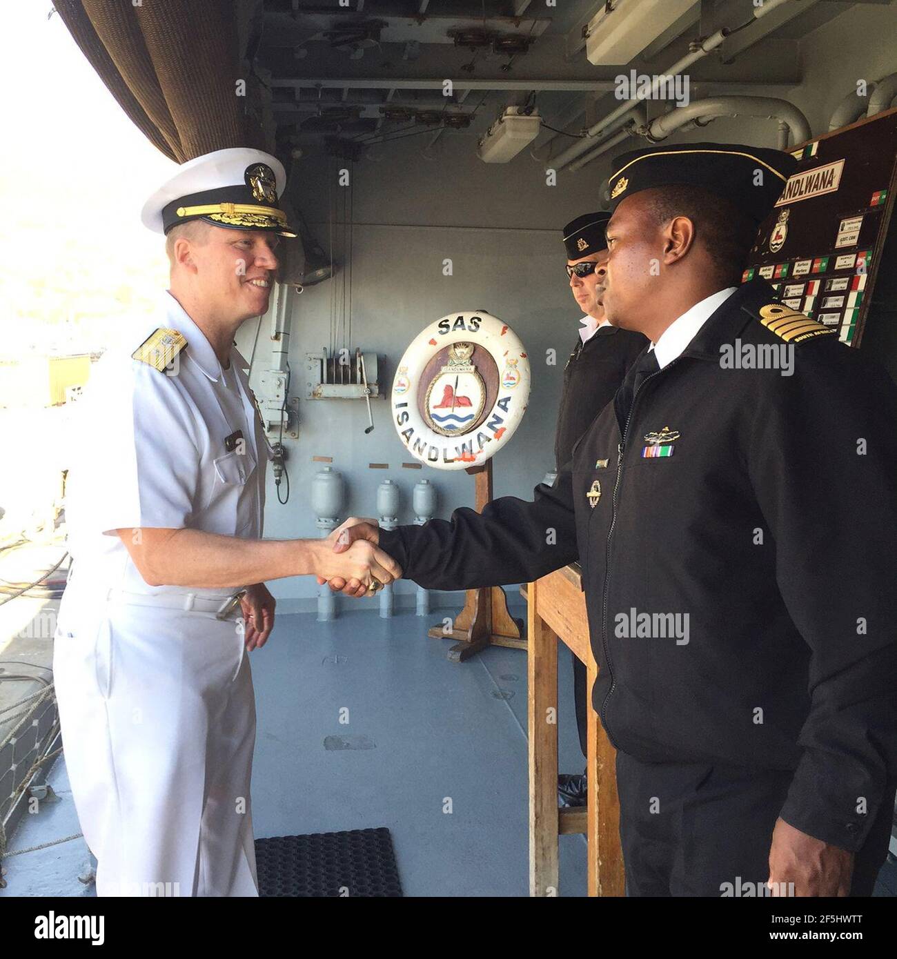 Rear Adm. Tom Reck, left, is greeted by Capt. Jabu Mbotho Stock Photo ...