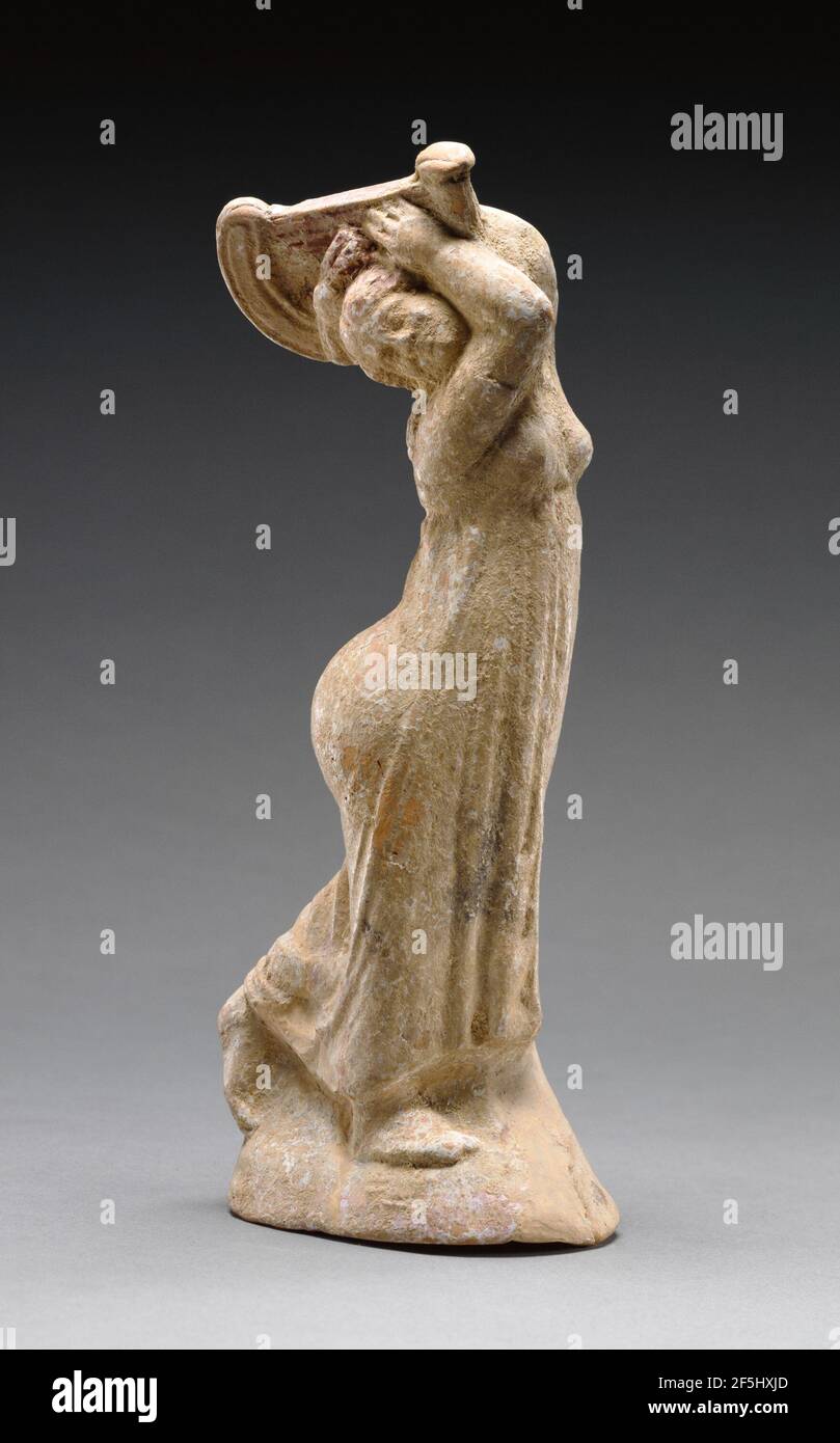 Statuette of a Woman with a Kithara. Unknown Stock Photo - Alamy
