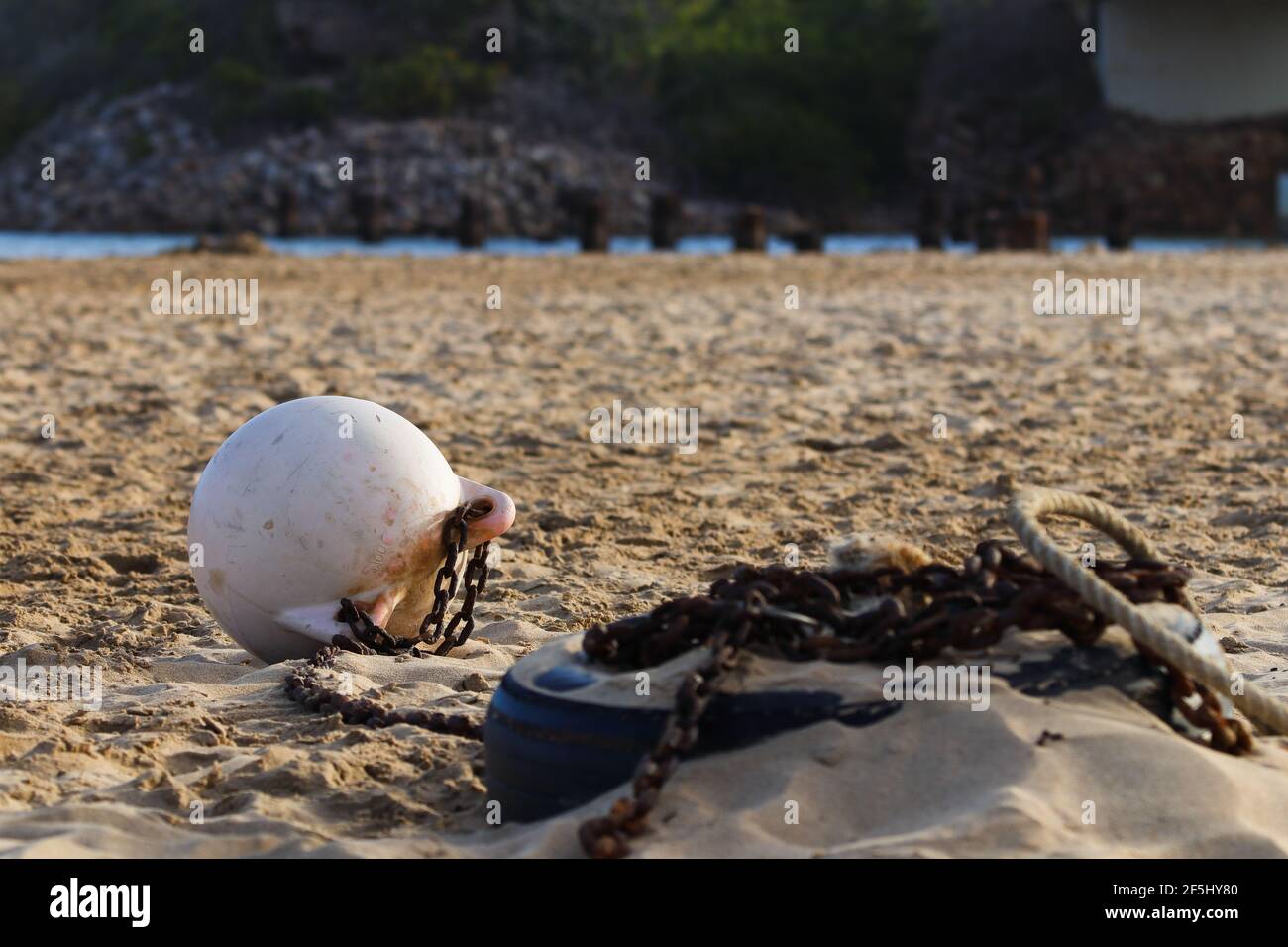 White Buoy Tied To Rusty Chain On Coastal River Sandbank Stock Photo ...