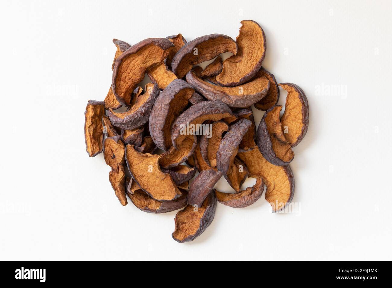 Homemade sun-dried organic apple slices on white background, crispy ...