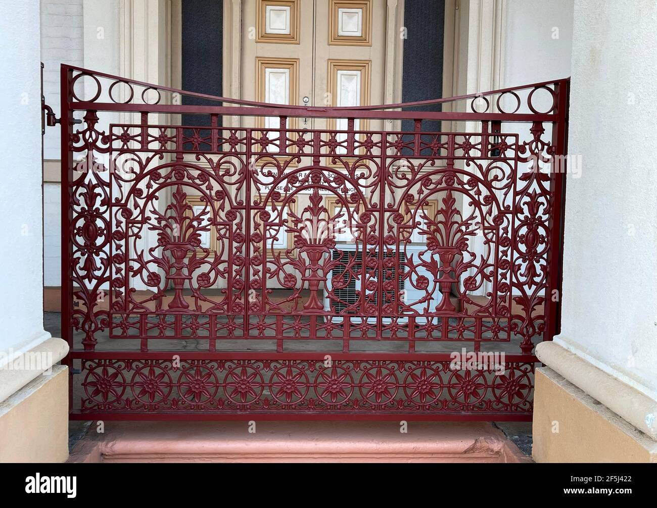 Detail of the wrought iton gate in front of the main entrance of the ...