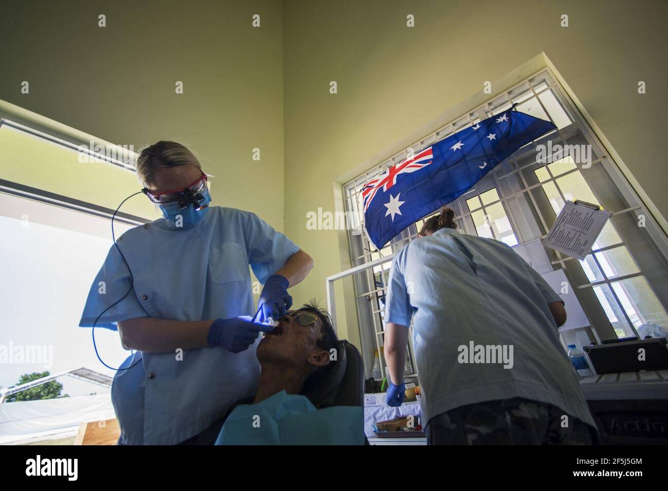 RAAF dentist performing a tooth extraction in Vietnam during September ...