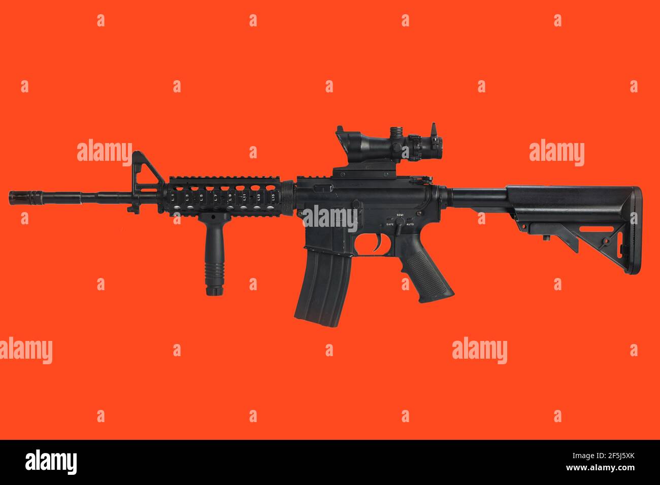 Assault rifle with optic sight and a foregrip on red background Stock ...