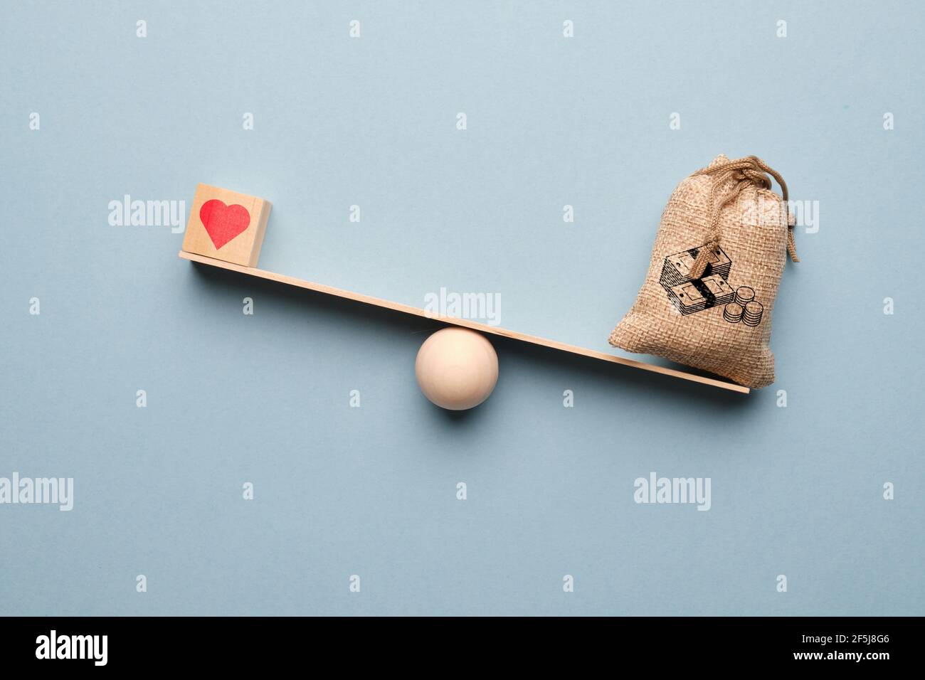 Scale money heart hi-res stock photography and images - Alamy