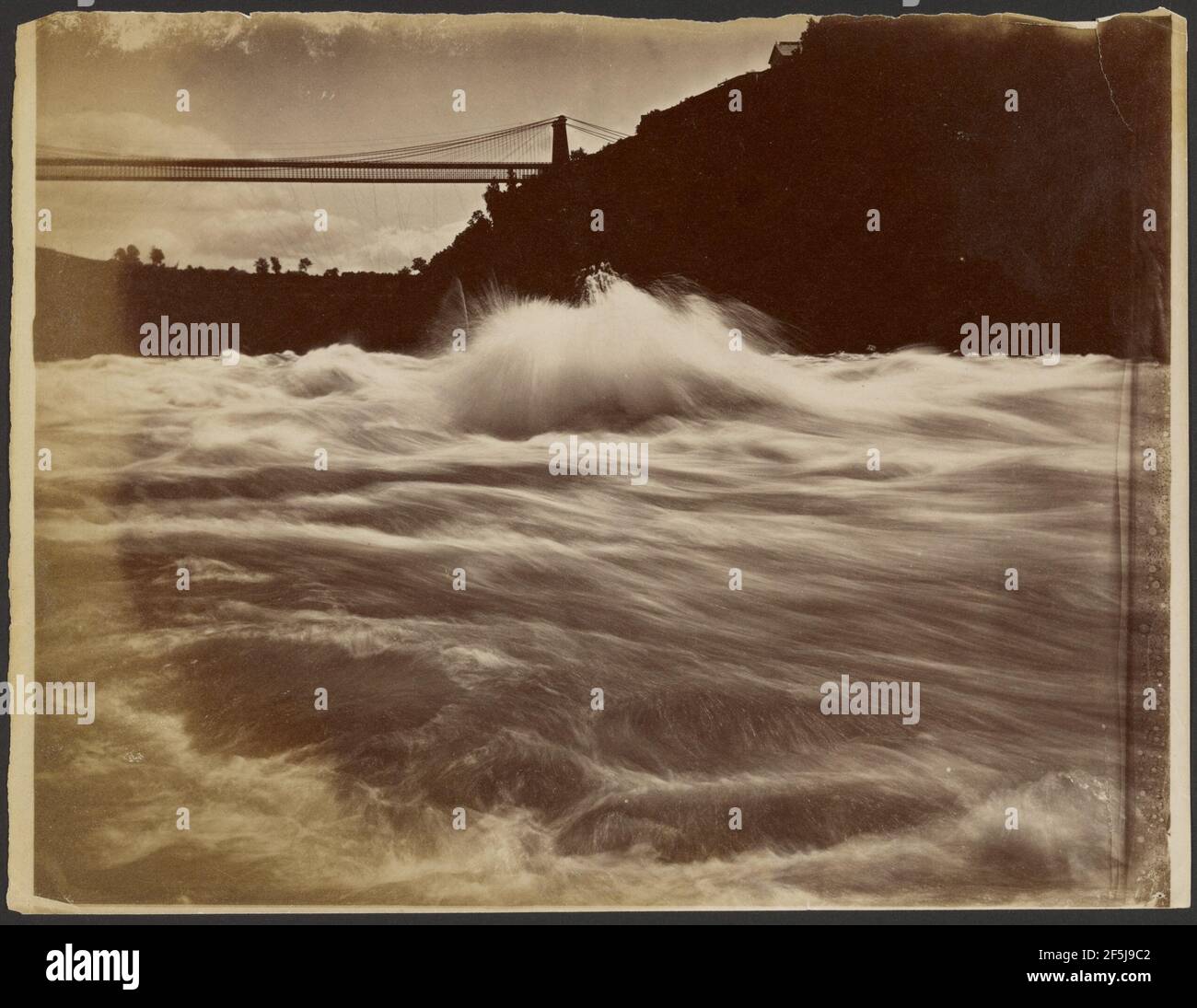 Rough waters below suspension bridge. Unknown maker, American Stock Photo - Alamy