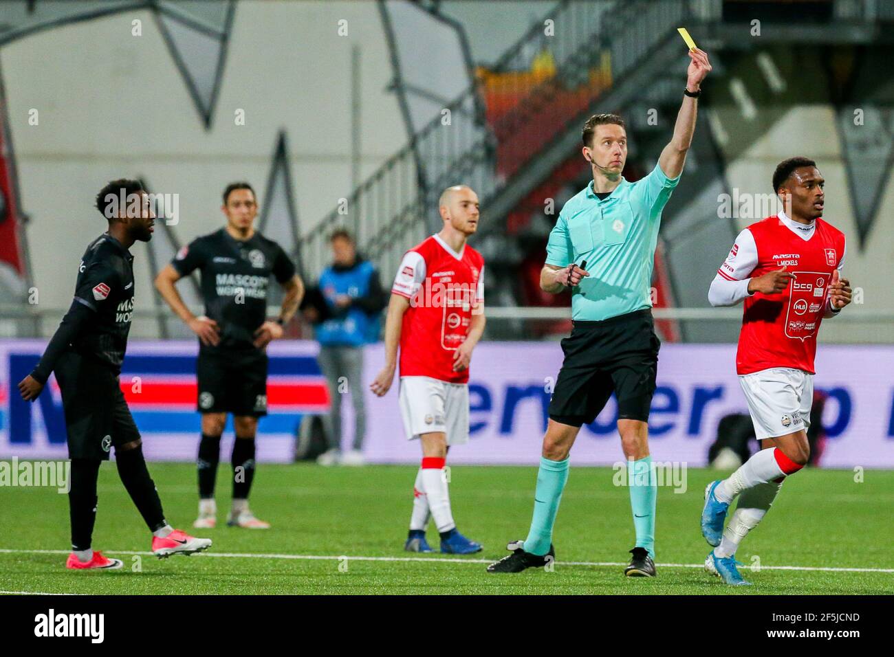 MAASTRICHT, NETHERLANDS - MARCH 26: Yellow card given by Referee Dhr ...