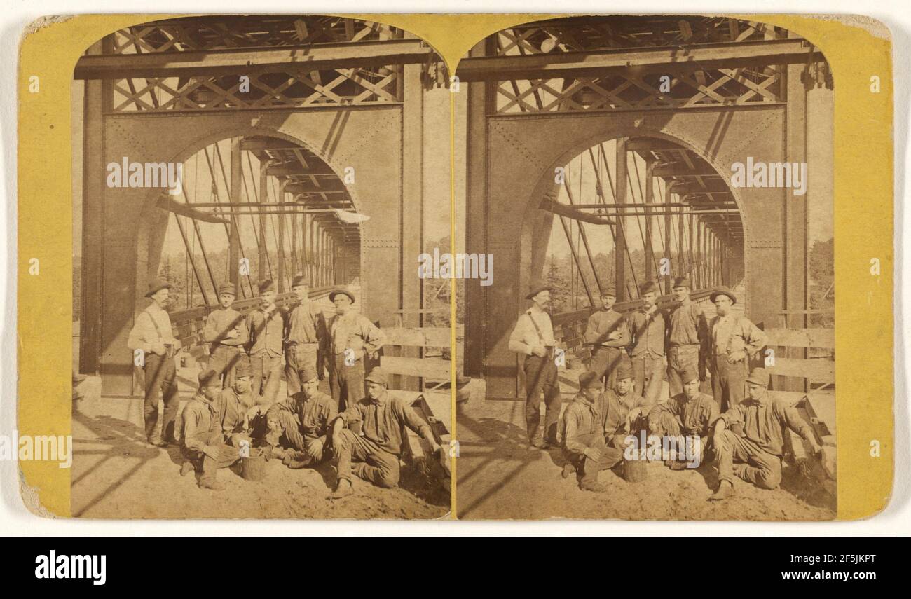 Men posing at entrance to bridge. Unknown Stock Photo - Alamy